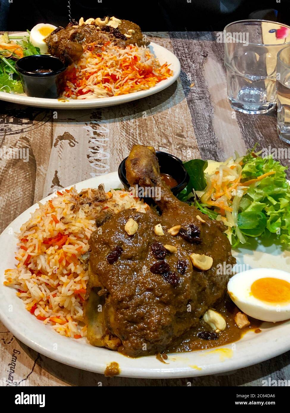 A plate of chicken Biryani on a table Stock Photo - Alamy