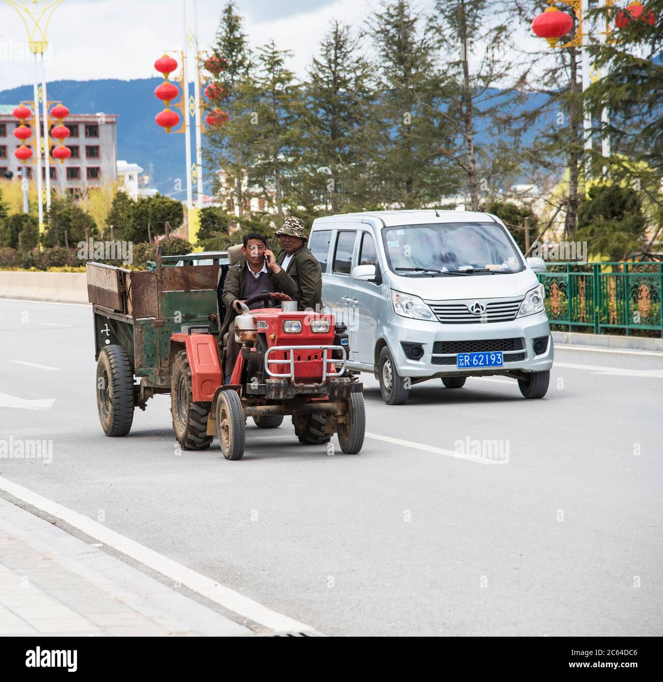 Driving an old vehicle on the road in the Yunnan Province of South West ...