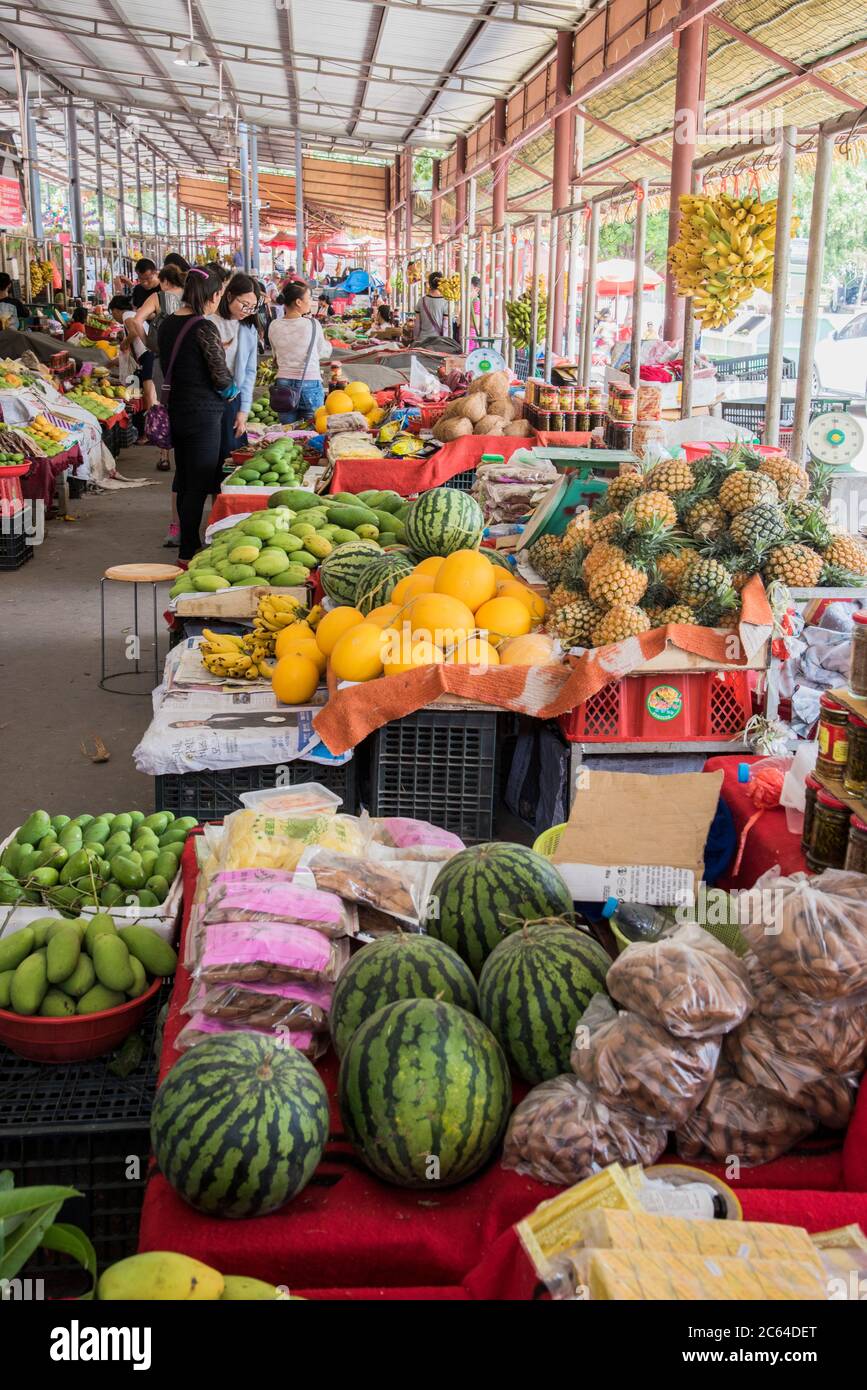 Local people buying and selling from a traditional food street market ...