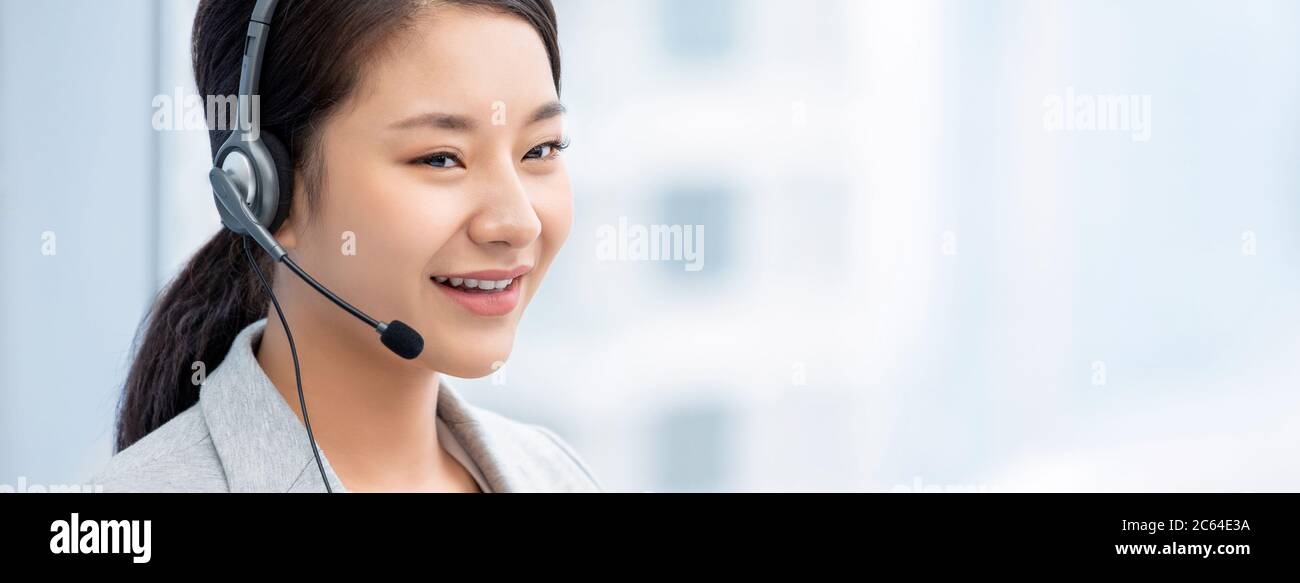 Banner of smiling beautiful Asian female customer service operator ...