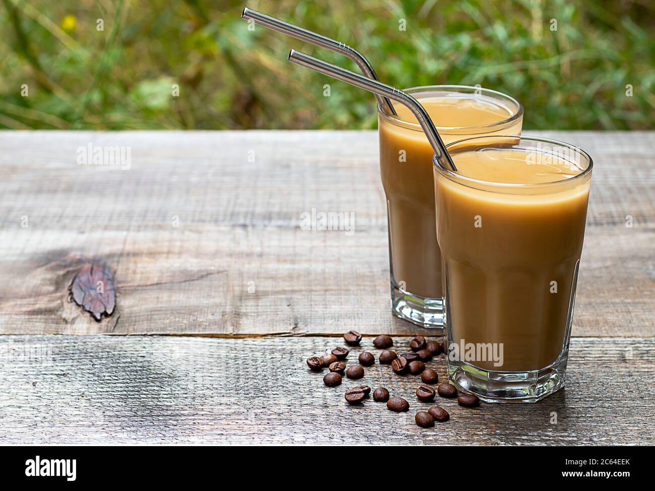 Ice coffee latte in a tall glass with almond milk Stock Photo - Alamy