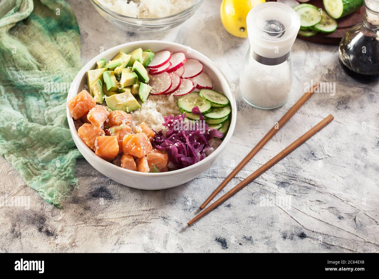 Poke bowl, traditional Hawaiian raw fish salad with rice, avocado ...