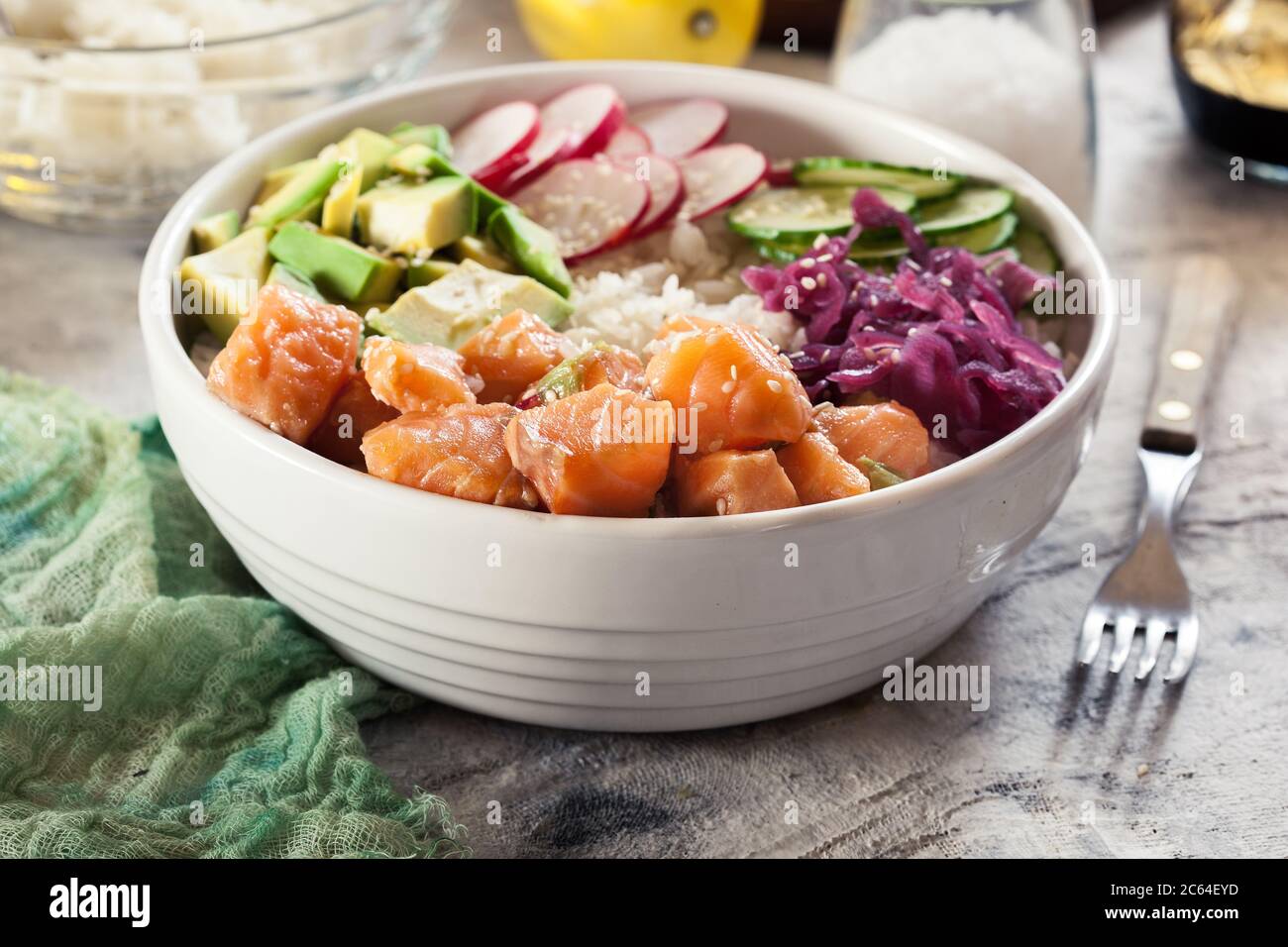 Poke bowl, traditional Hawaiian raw fish salad with rice, avocado ...