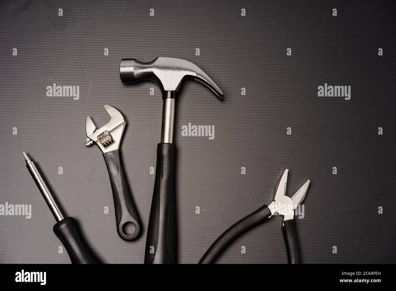 Flat lay composition of a set of tools, including hammer, pliers ...