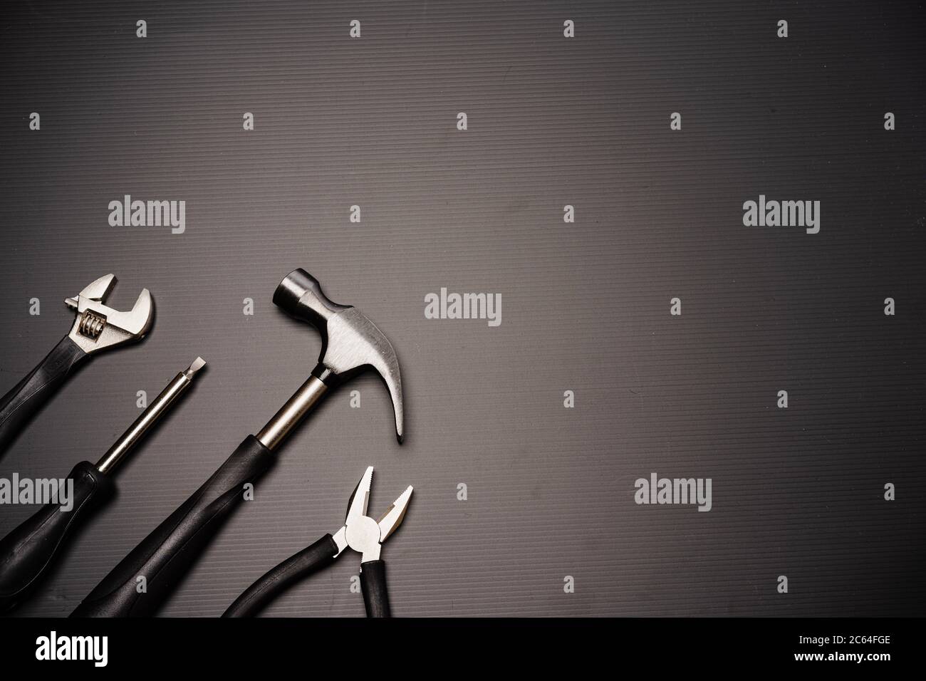 Flat lay composition of a set of tools, including hammer, pliers ...