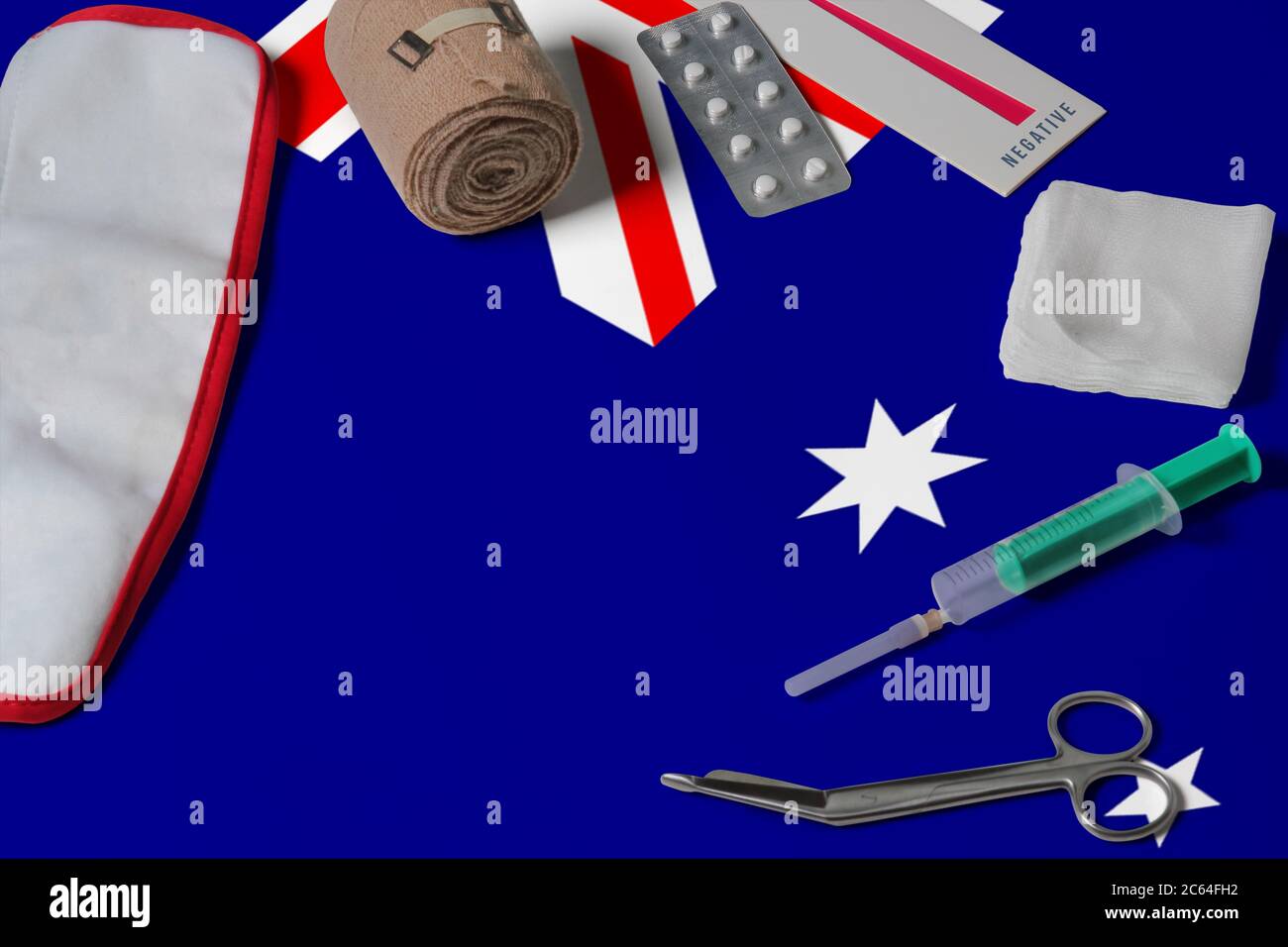 Australia flag with first aid medical kit on wooden table background ...