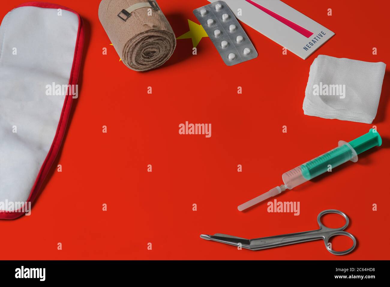 China flag with first aid medical kit on wooden table background ...