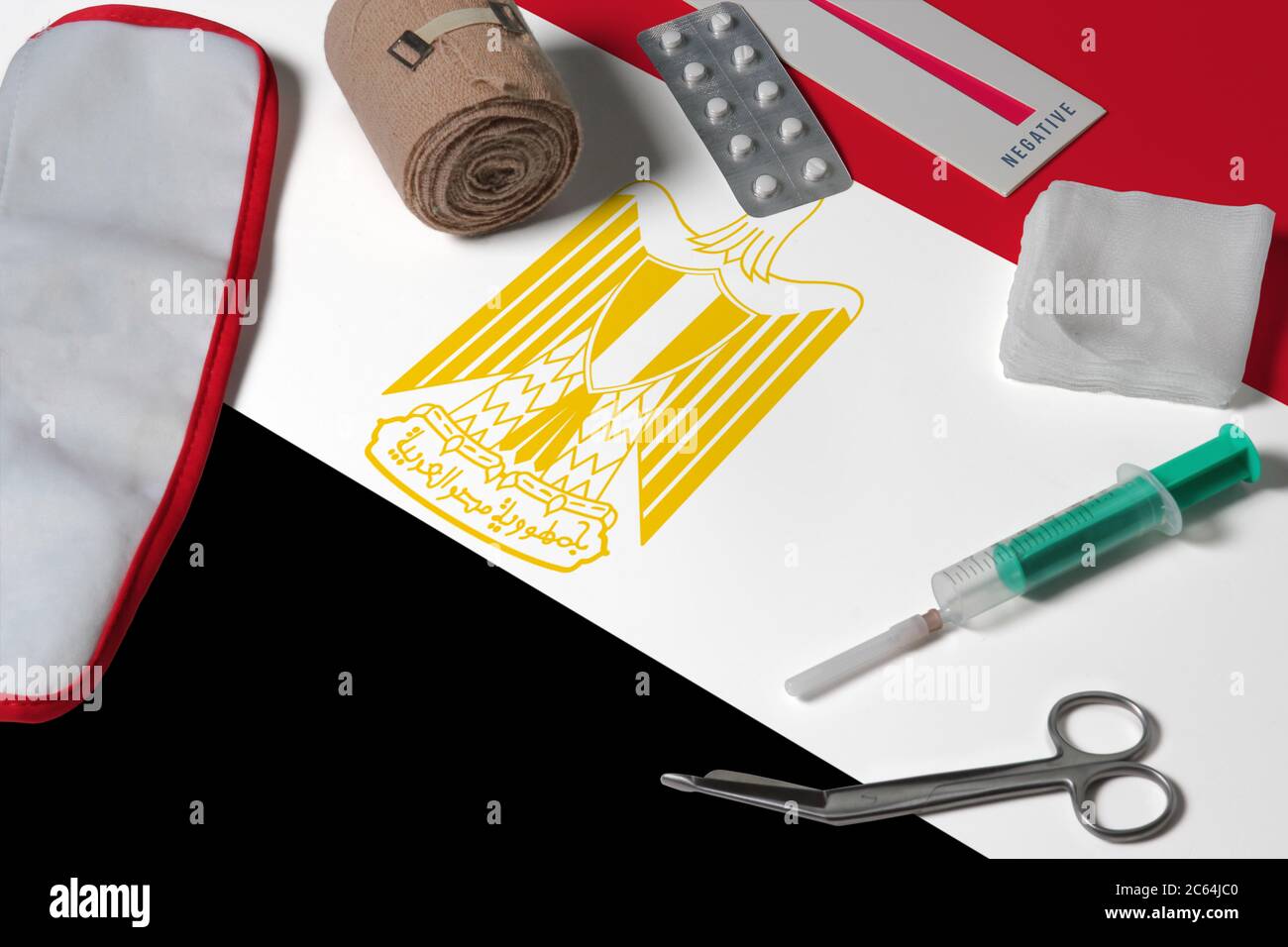 Egypt flag with first aid medical kit on wooden table background ...