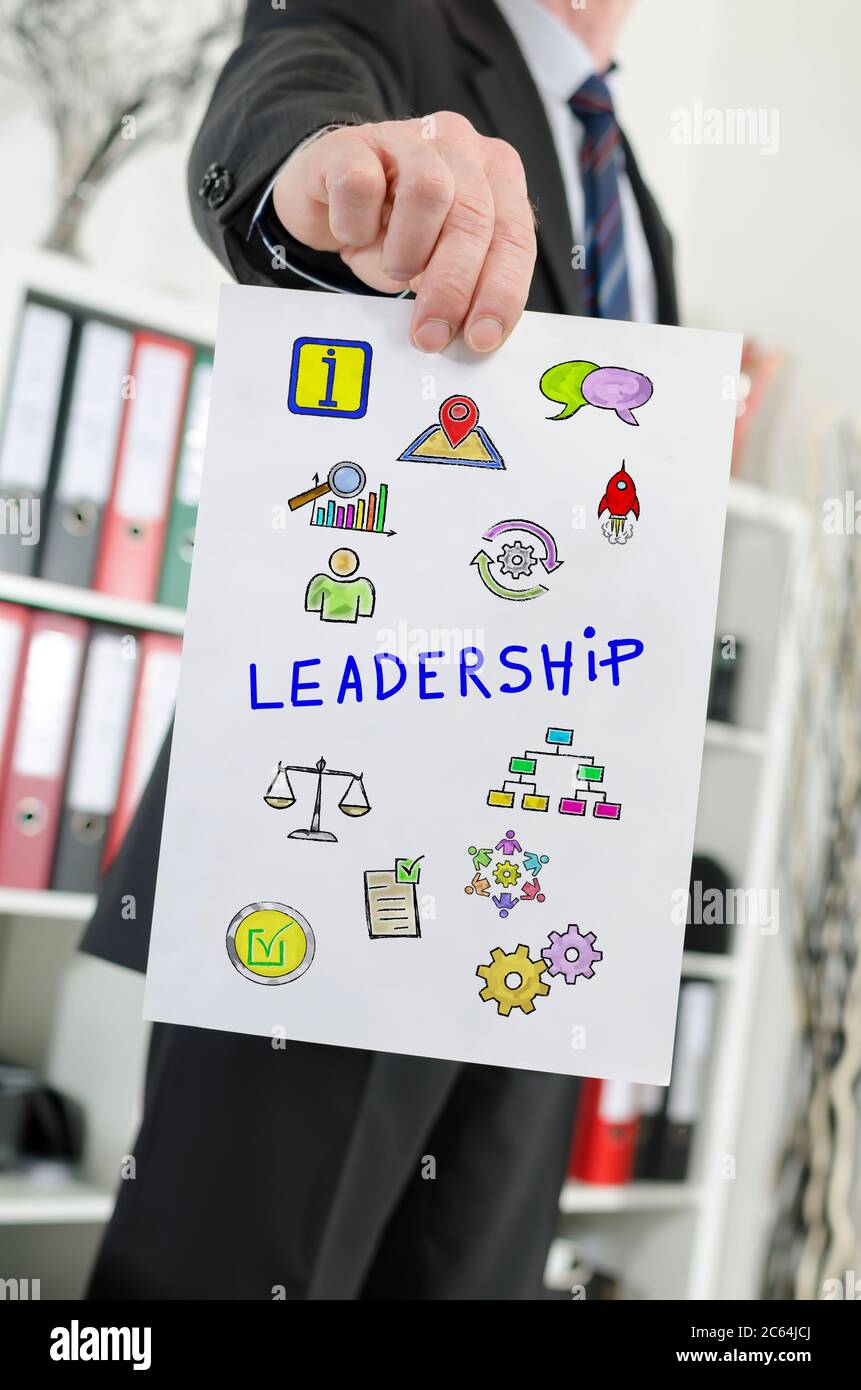 Paper showing leadership concept held by a businessman Stock Photo - Alamy