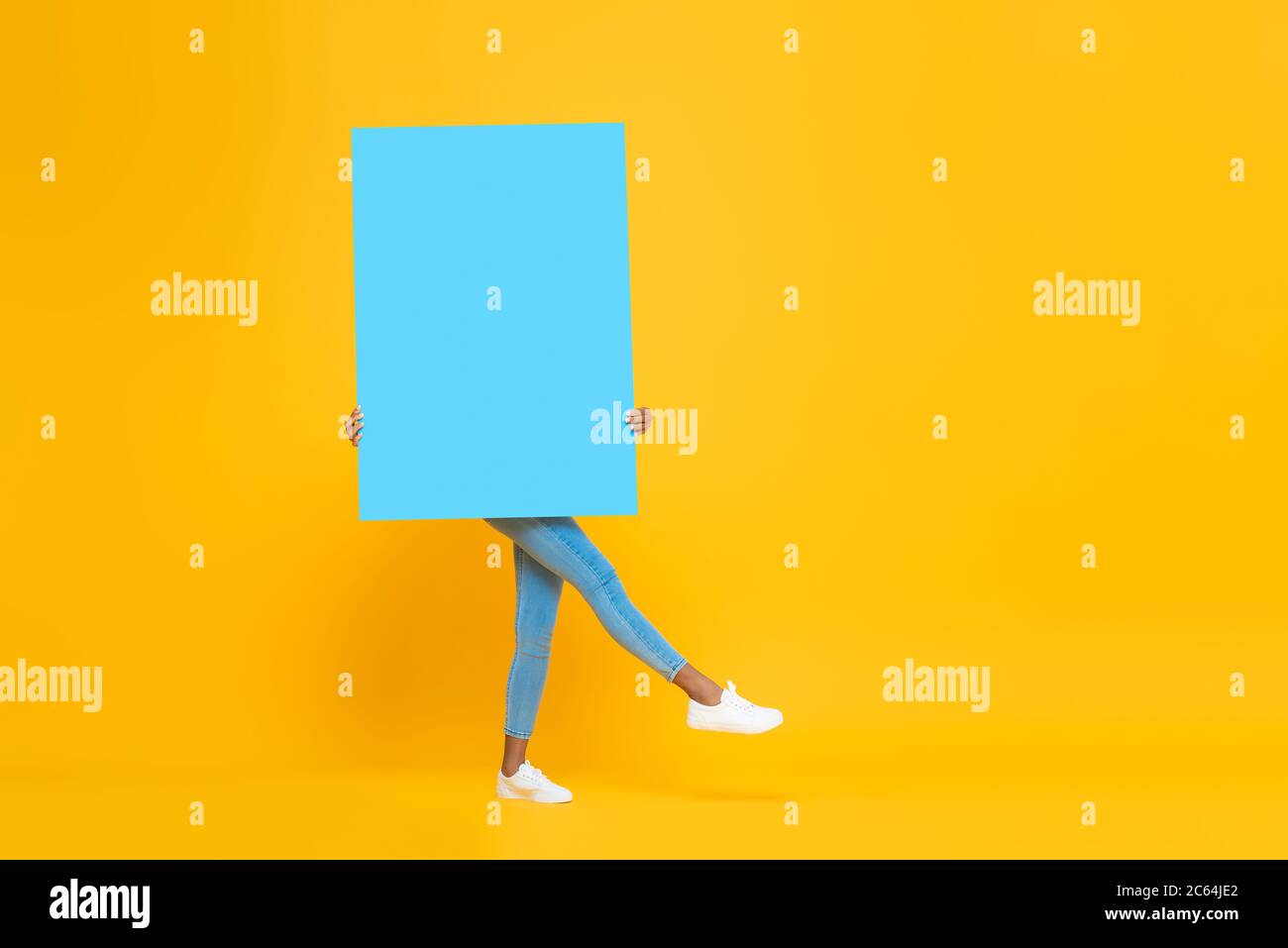 Girl hiding face behind paper hi-res stock photography and images - Alamy