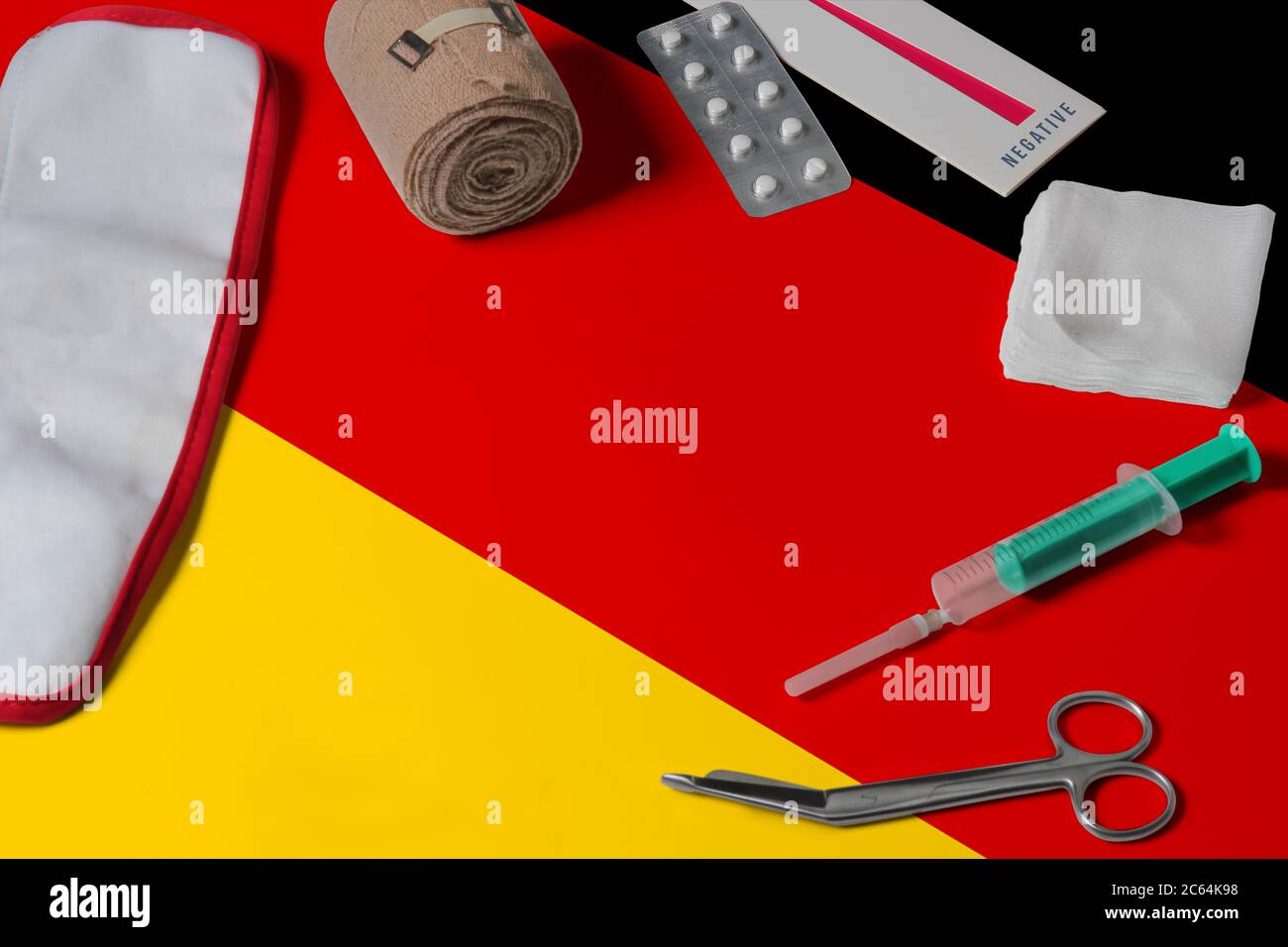 Germany flag with first aid medical kit on wooden table background ...