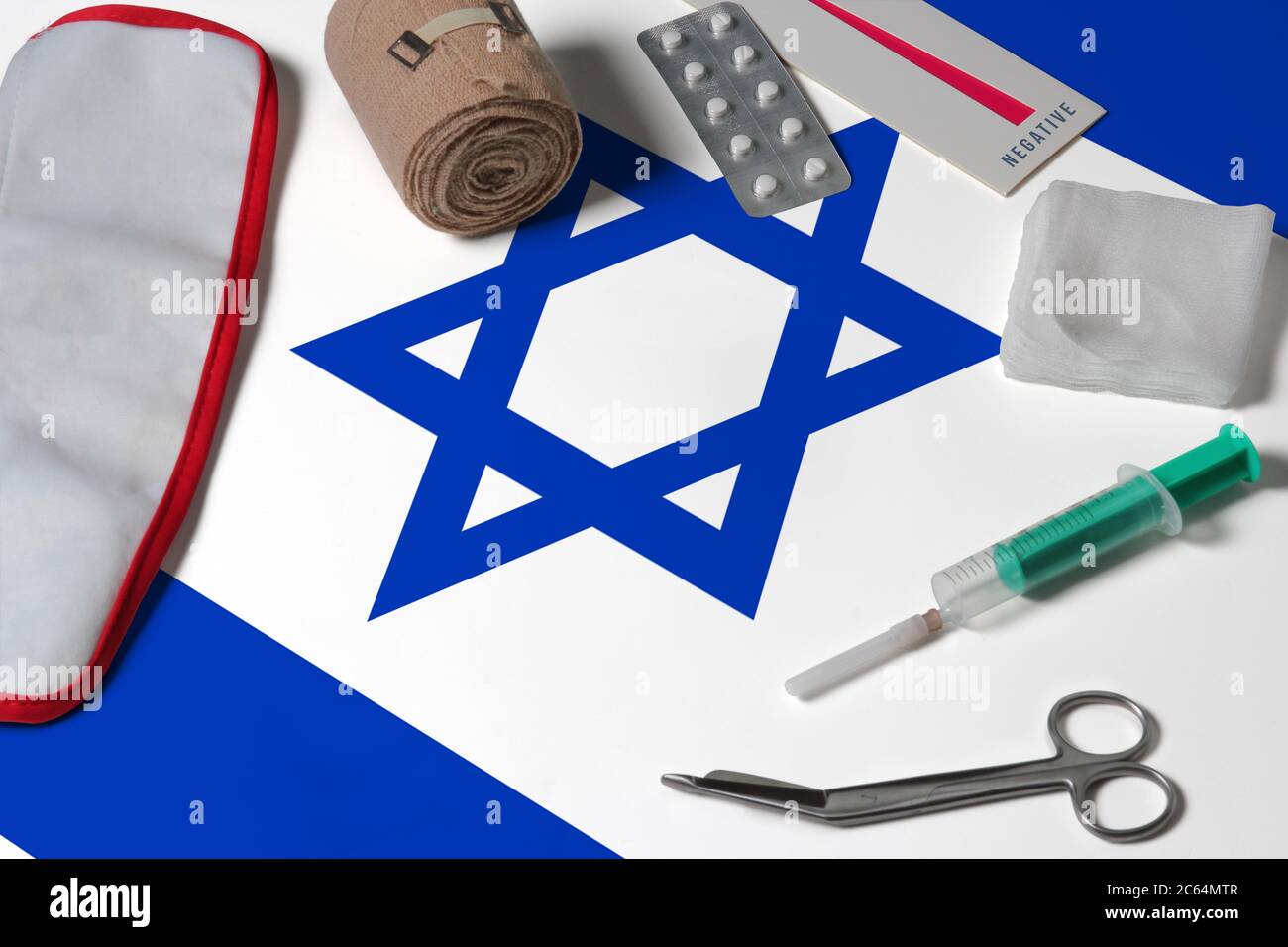 Israel flag with first aid medical kit on wooden table background ...