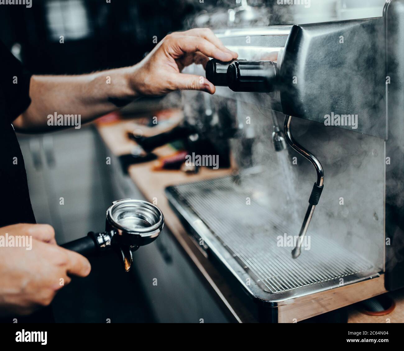 Hands Professional barista at work by an espresso machine - thick steam ...