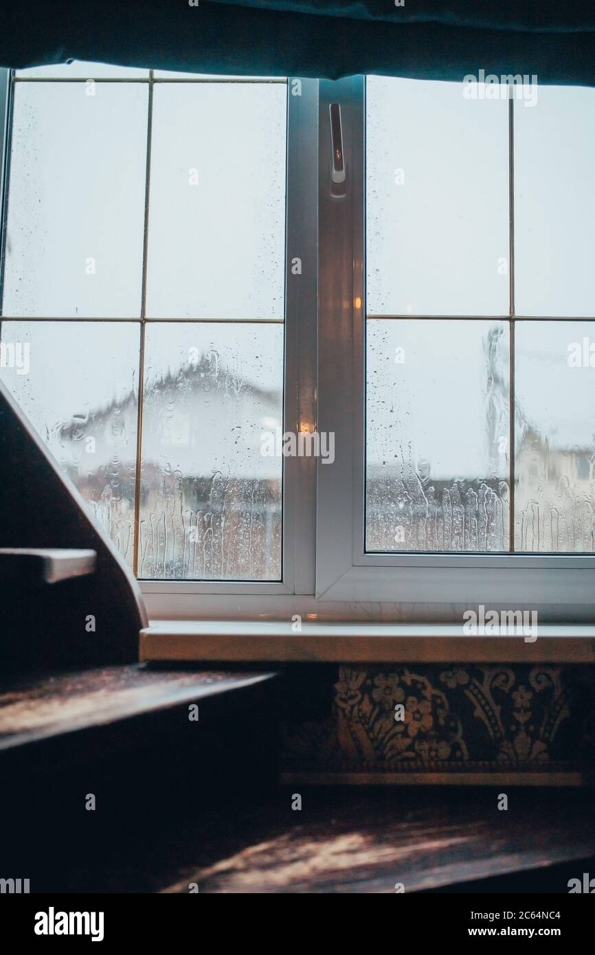 Outside the window of a country house, rainy weather - stairs to the ...