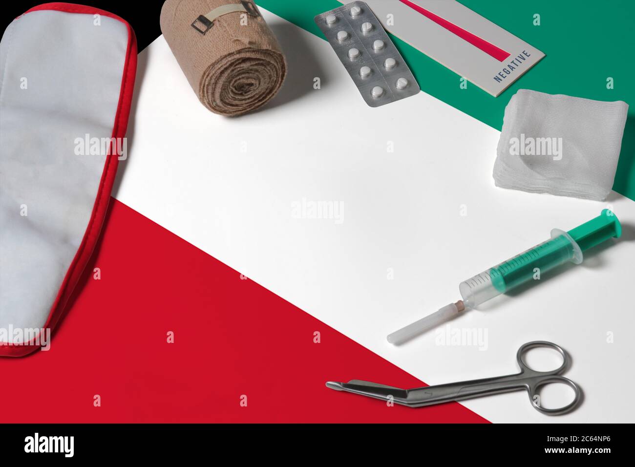Kuwait flag with first aid medical kit on wooden table background ...