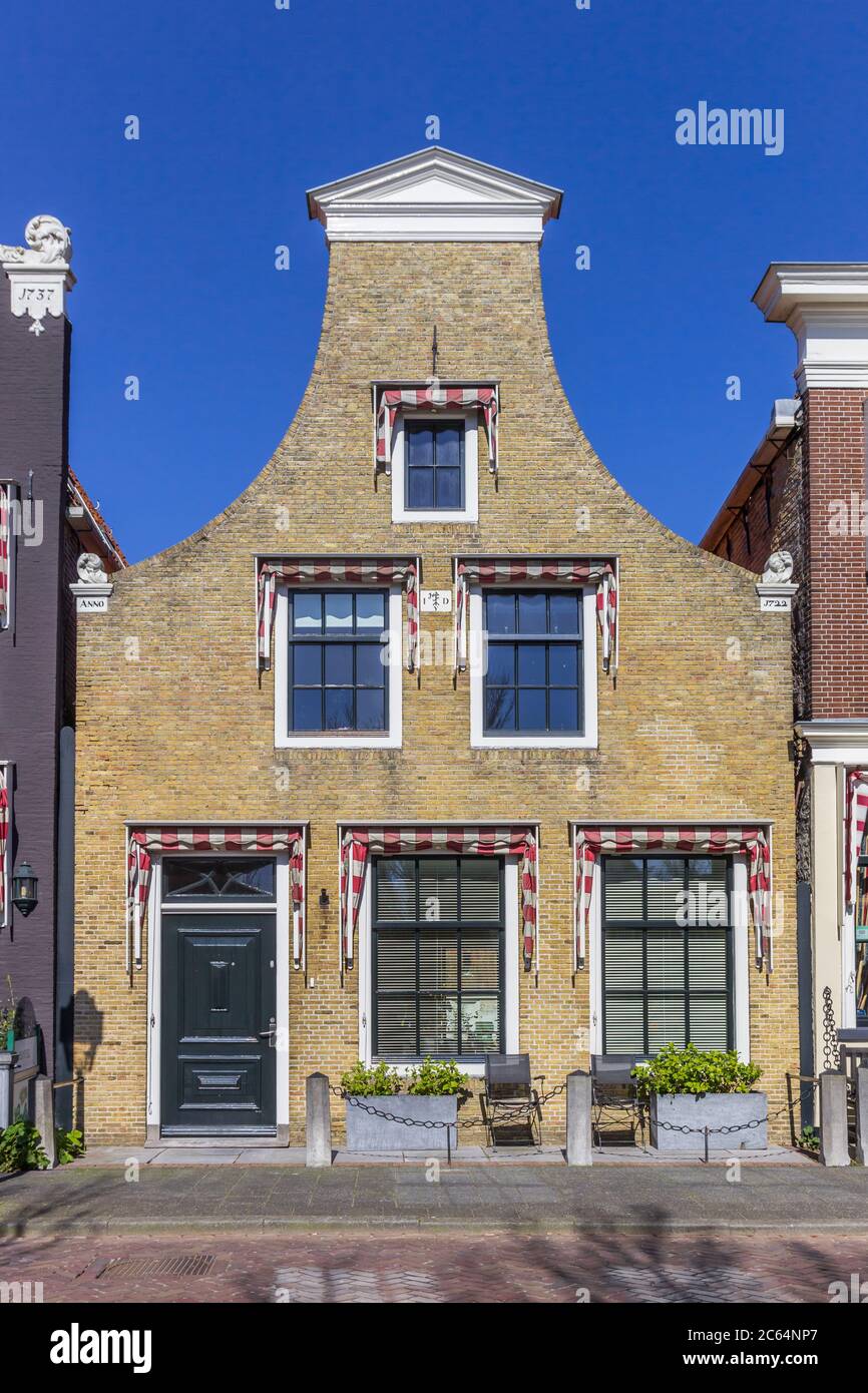 Front facade of a historic house with clock gable in Harlingen ...
