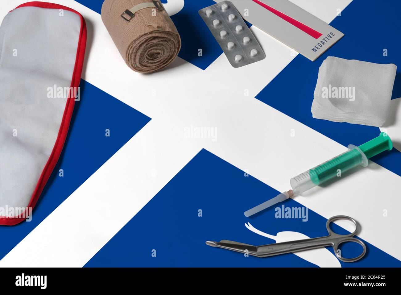 Martinique flag with first aid medical kit on wooden table background ...
