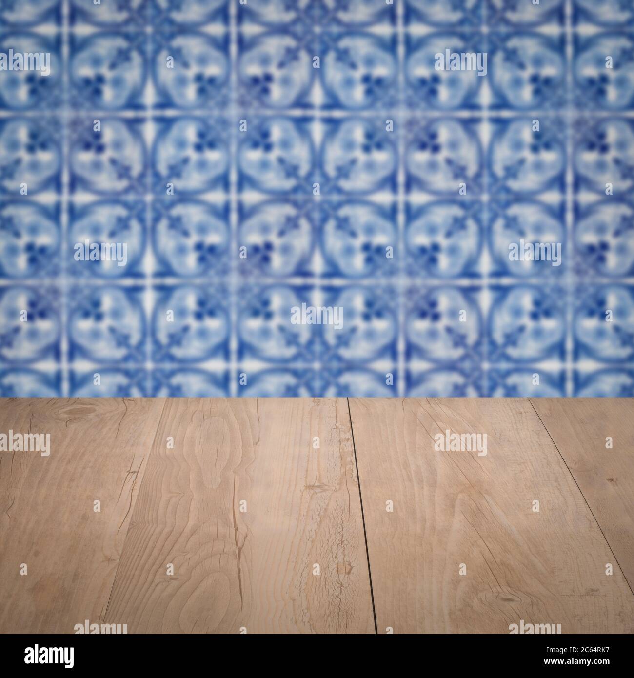 Empty wood table top and blur vintage ceramic tile pattern wall in ...