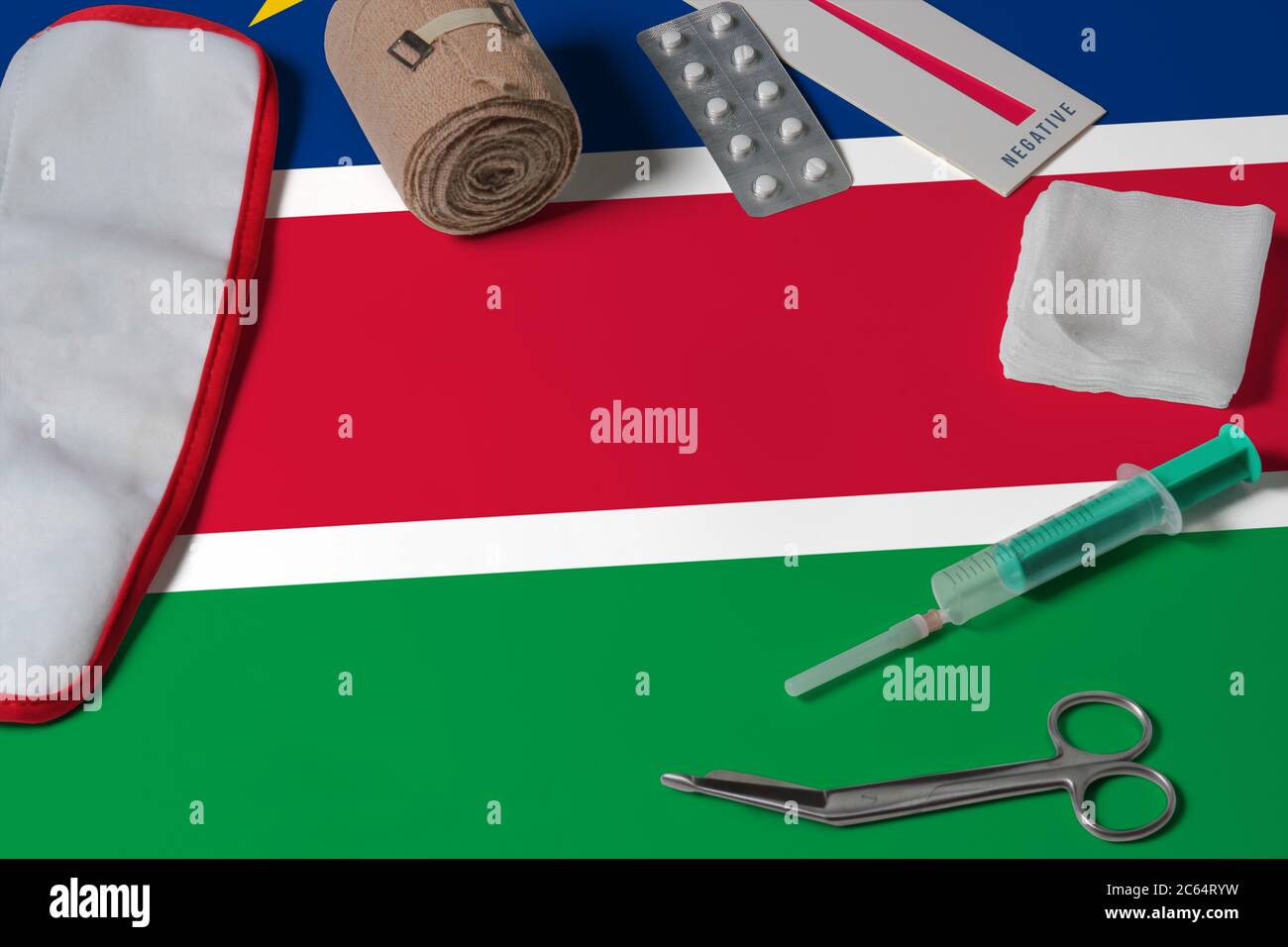 Namibia flag with first aid medical kit on wooden table background ...
