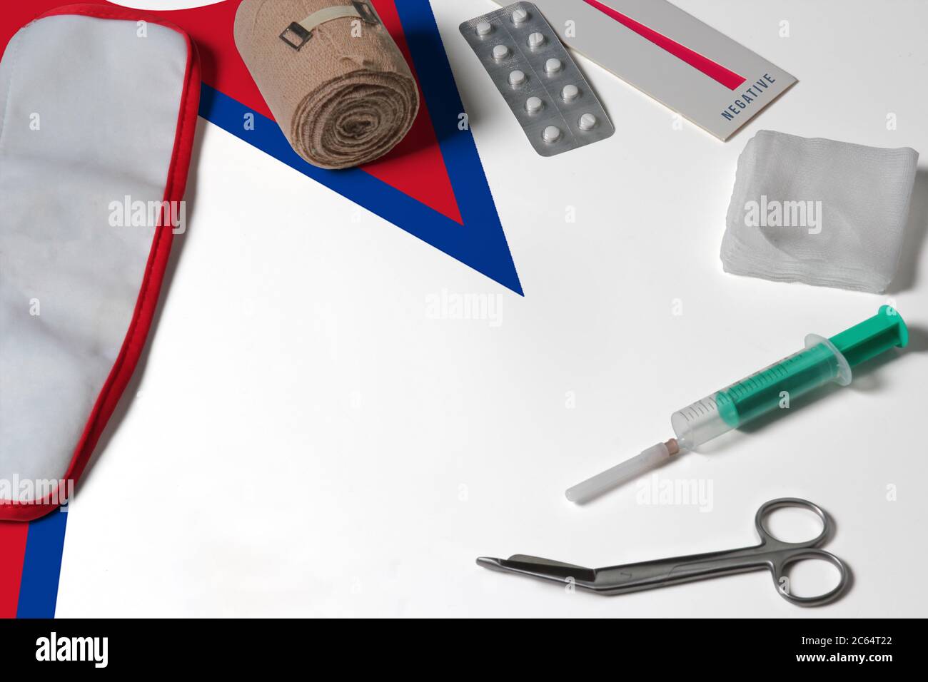 Nepal flag with first aid medical kit on wooden table background ...