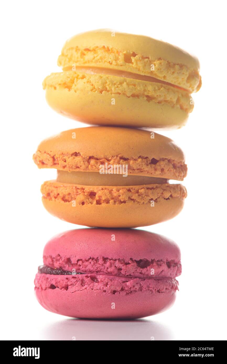 Three macaroons standing on top of each other on white background Stock ...