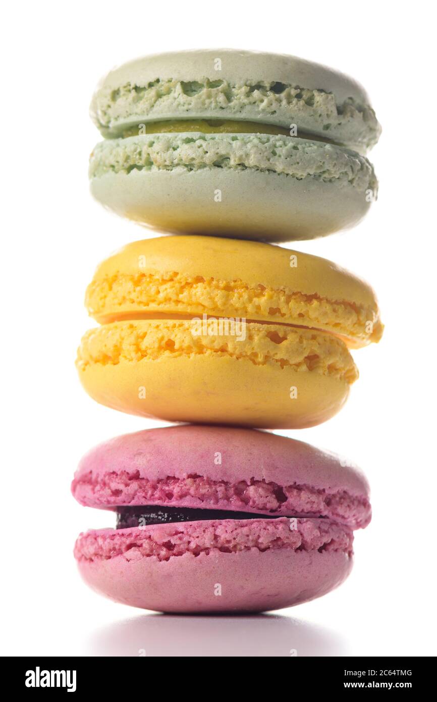 Three macaroons standing on top of each other on white background Stock ...
