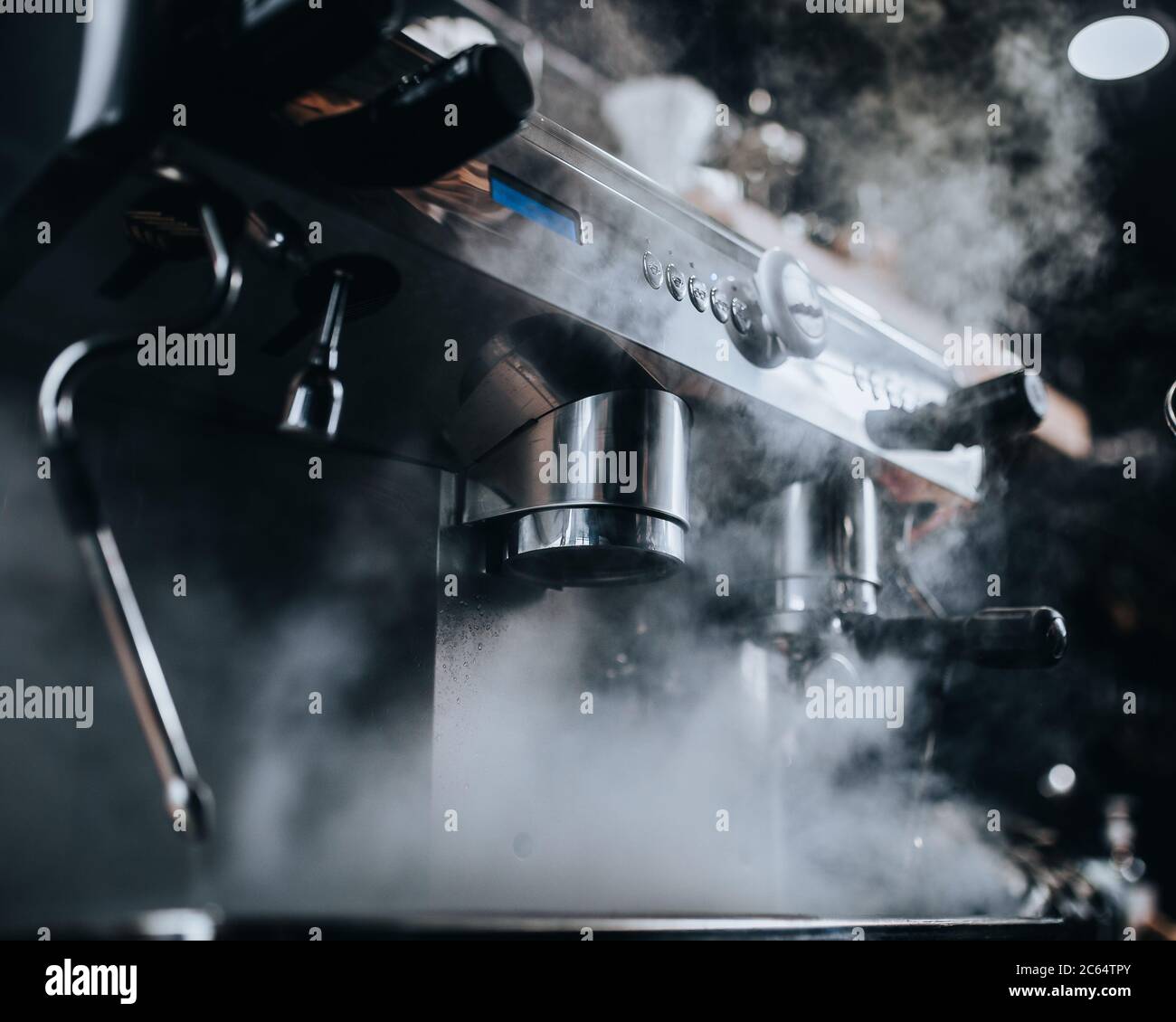 Thick steam is wrapped in a professional coffee machine - modern ...