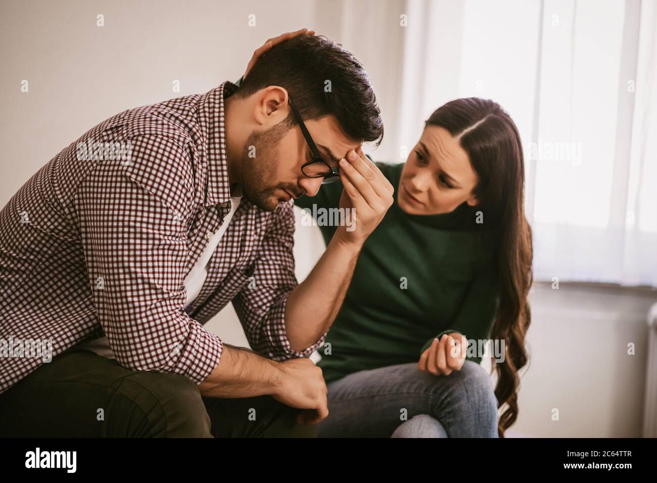 Husband consoling sad wife hi-res stock photography and images - Alamy