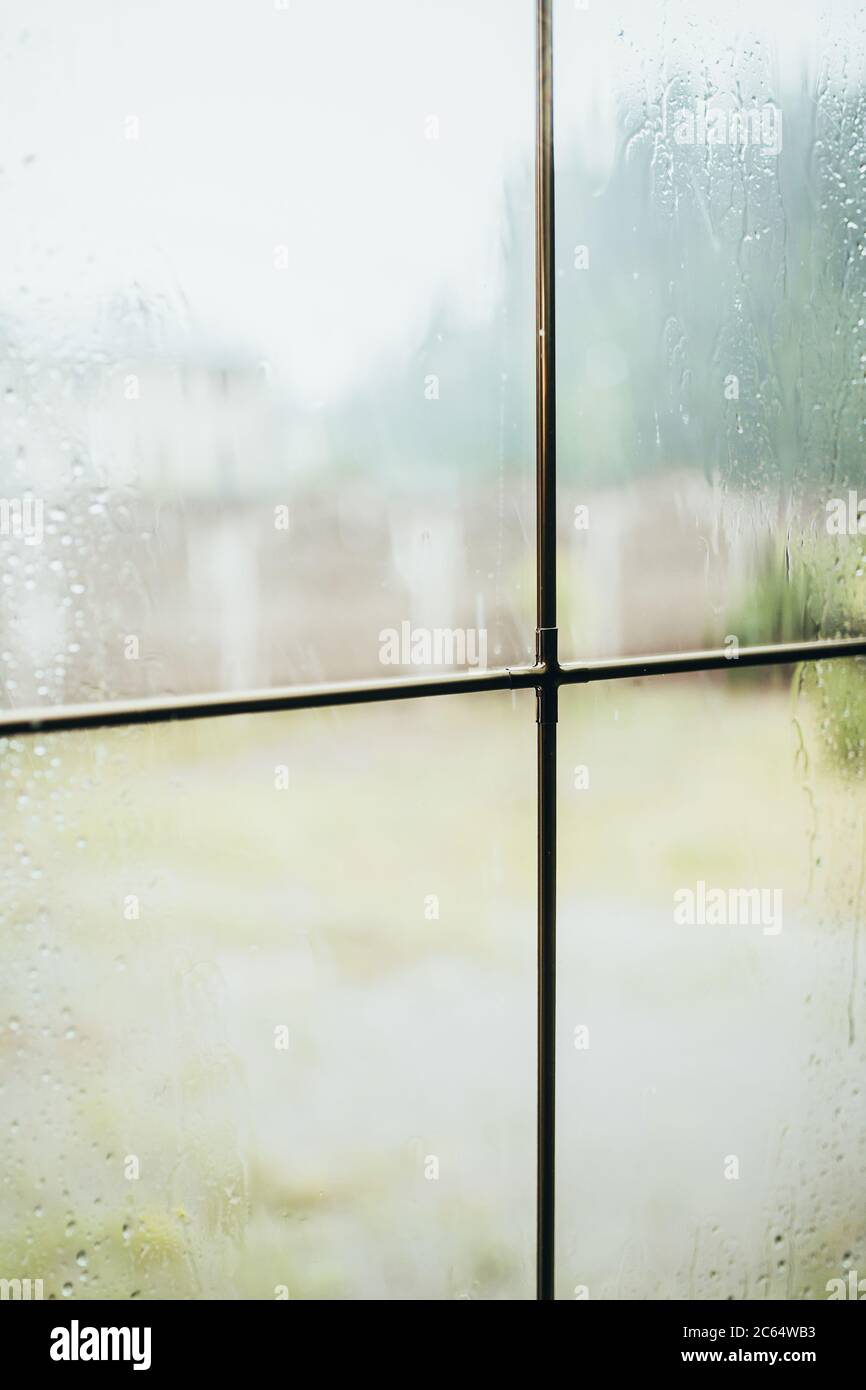 Cloudy rainy weather outside the window - blurry drops - sad mood of ...