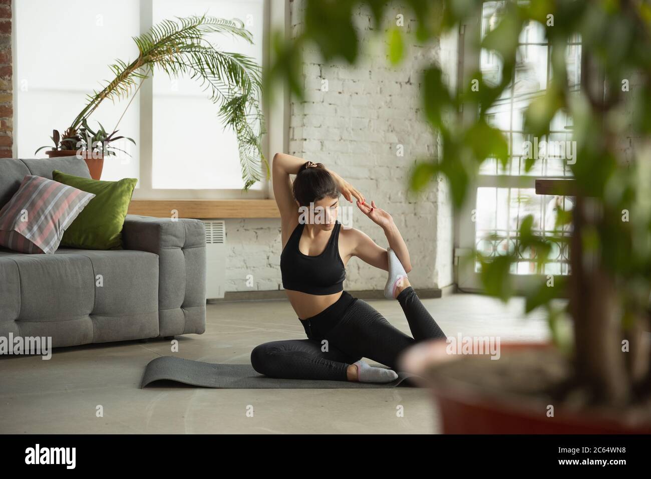 Balance. Sporty arabian, muslim beautiful young woman taking ...