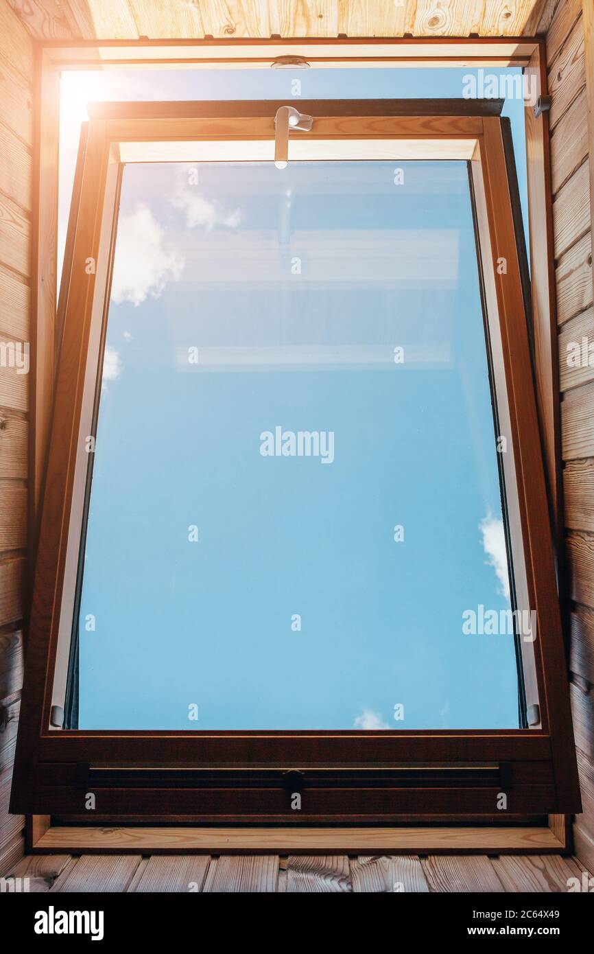 In the early morning, a dormer-window open for airing - fresh air into ...