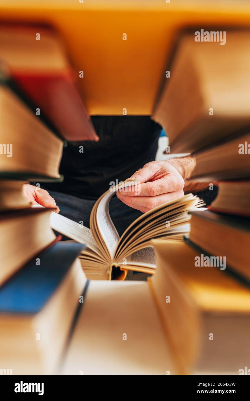Through the hole between books on a shelf in the library you can see ...