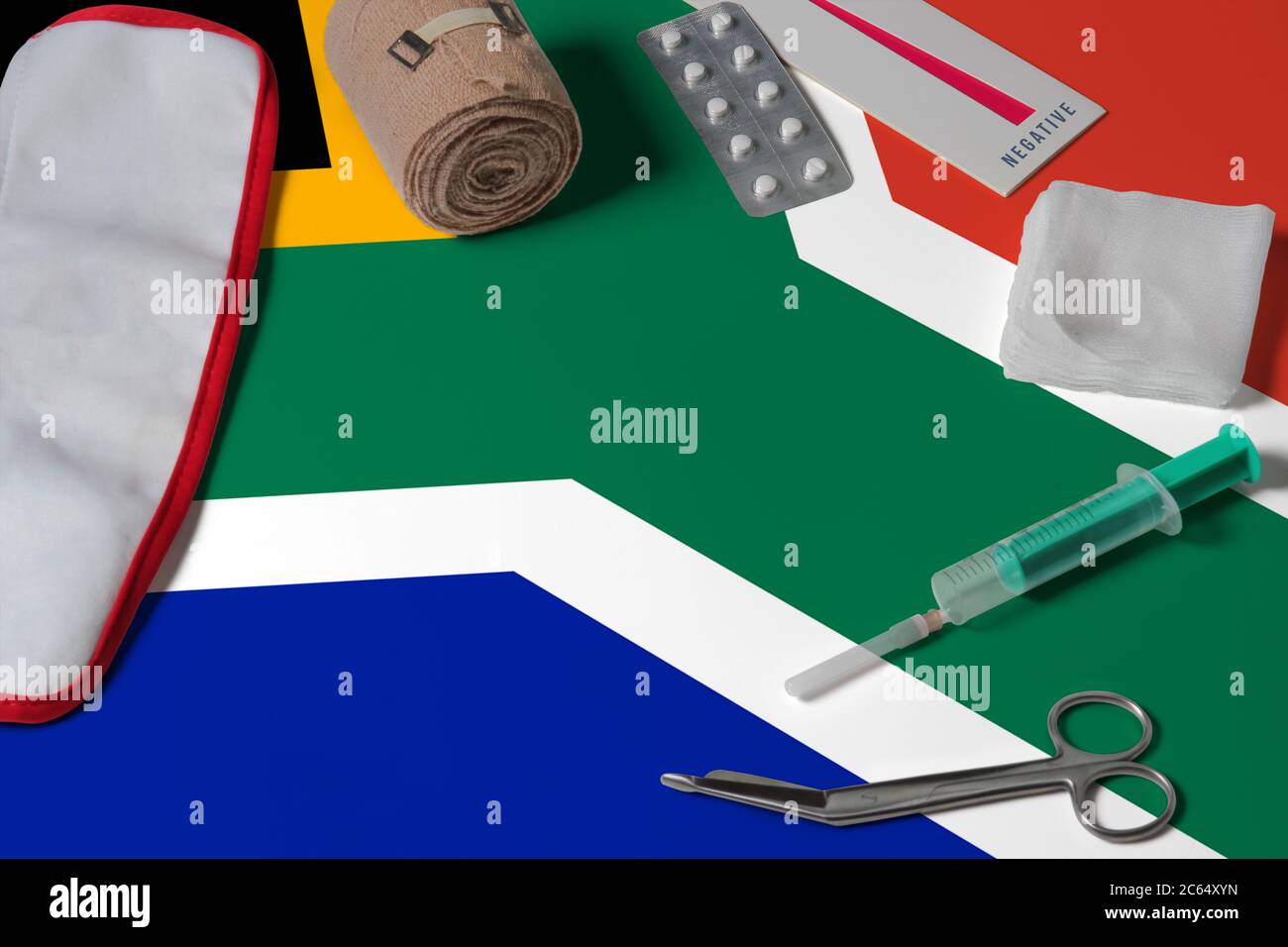 South Africa flag with first aid medical kit on wooden table background ...