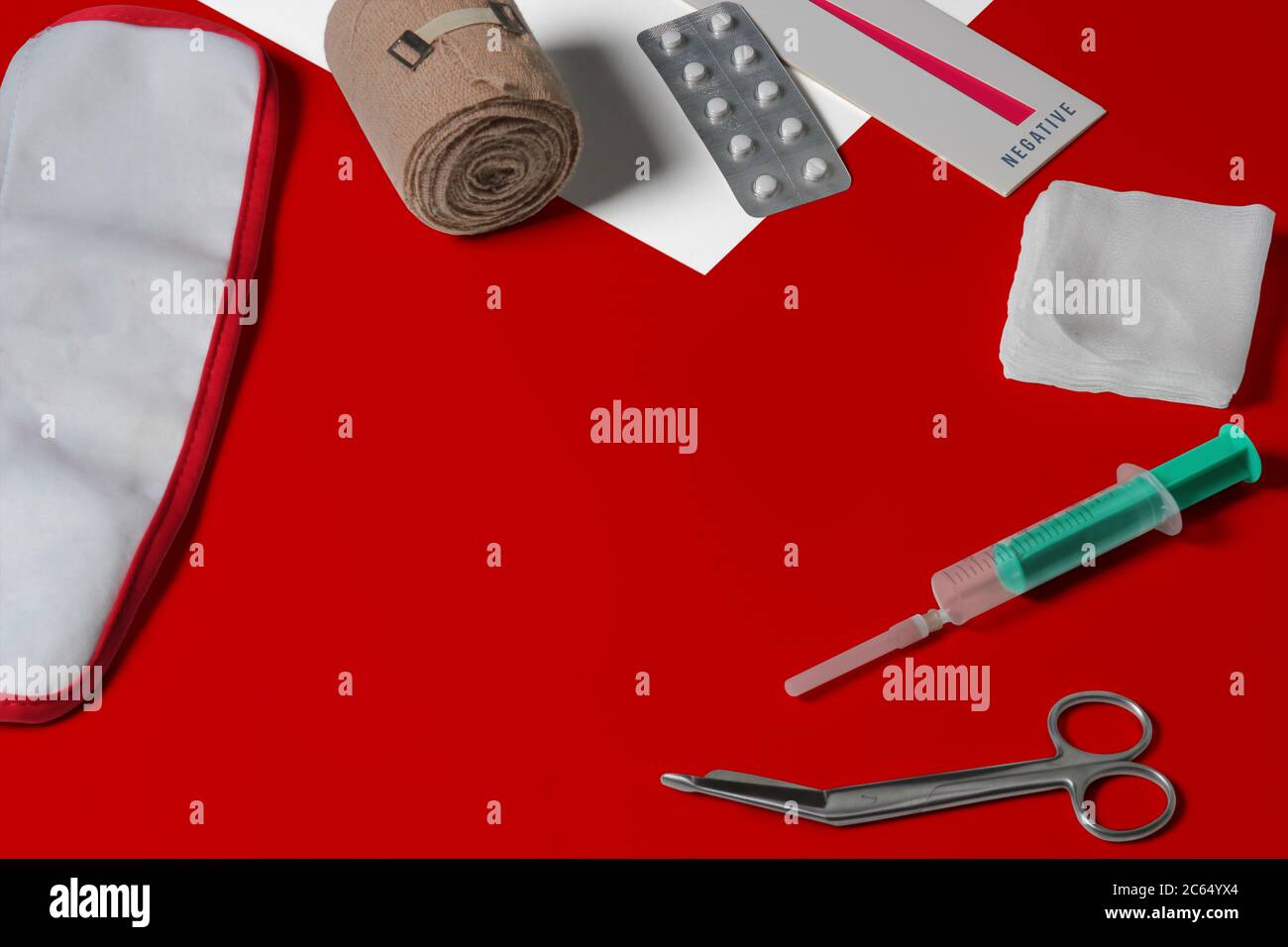 Tonga flag with first aid medical kit on wooden table background ...