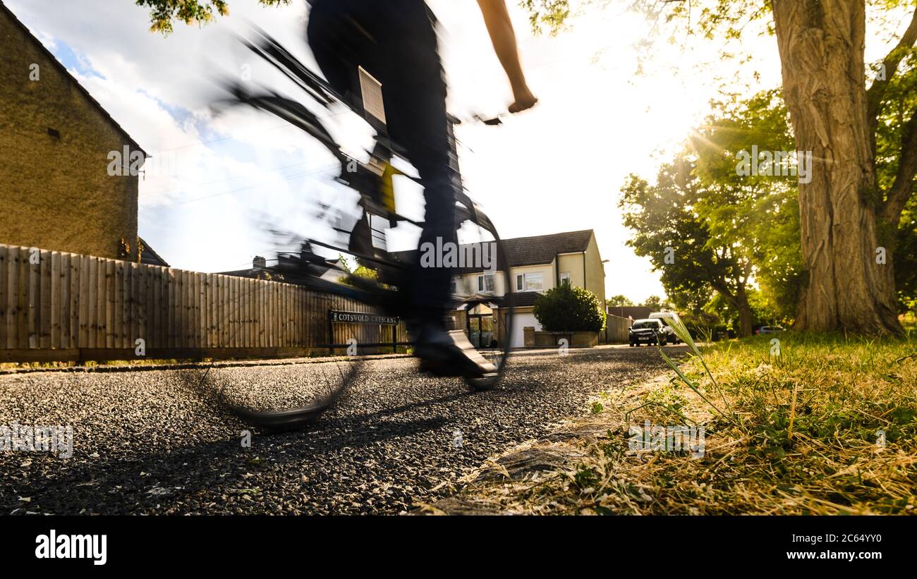 A bike going quickly past the viewer from the left. The bike is ...