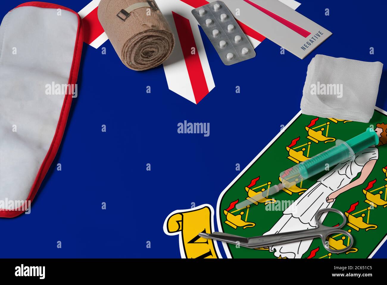 British Virgin Islands flag with first aid medical kit on wooden table ...