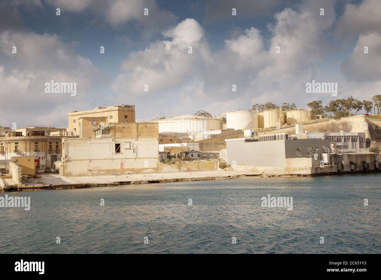 industrial units on the edge of the grand harbour in malta Stock Photo ...