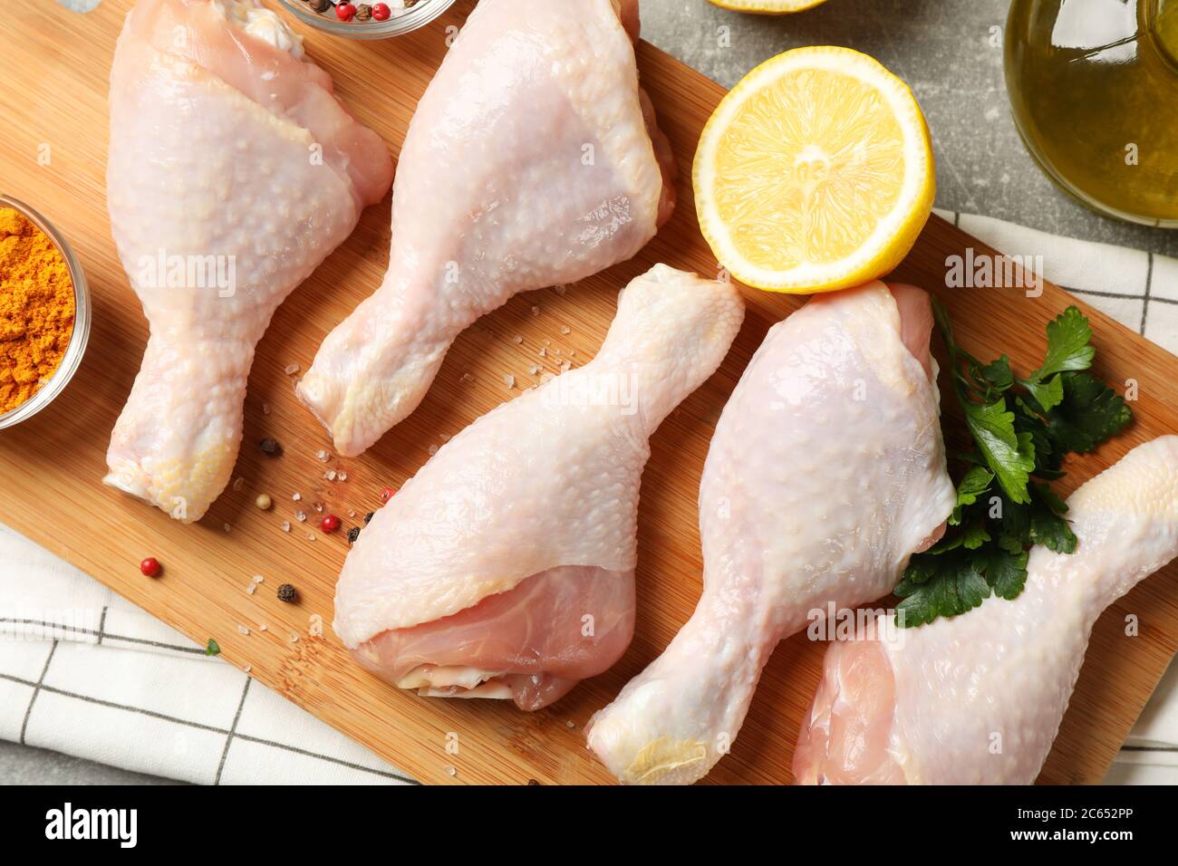 Board with raw chicken meat on gray background. Cooking chicken Stock ...