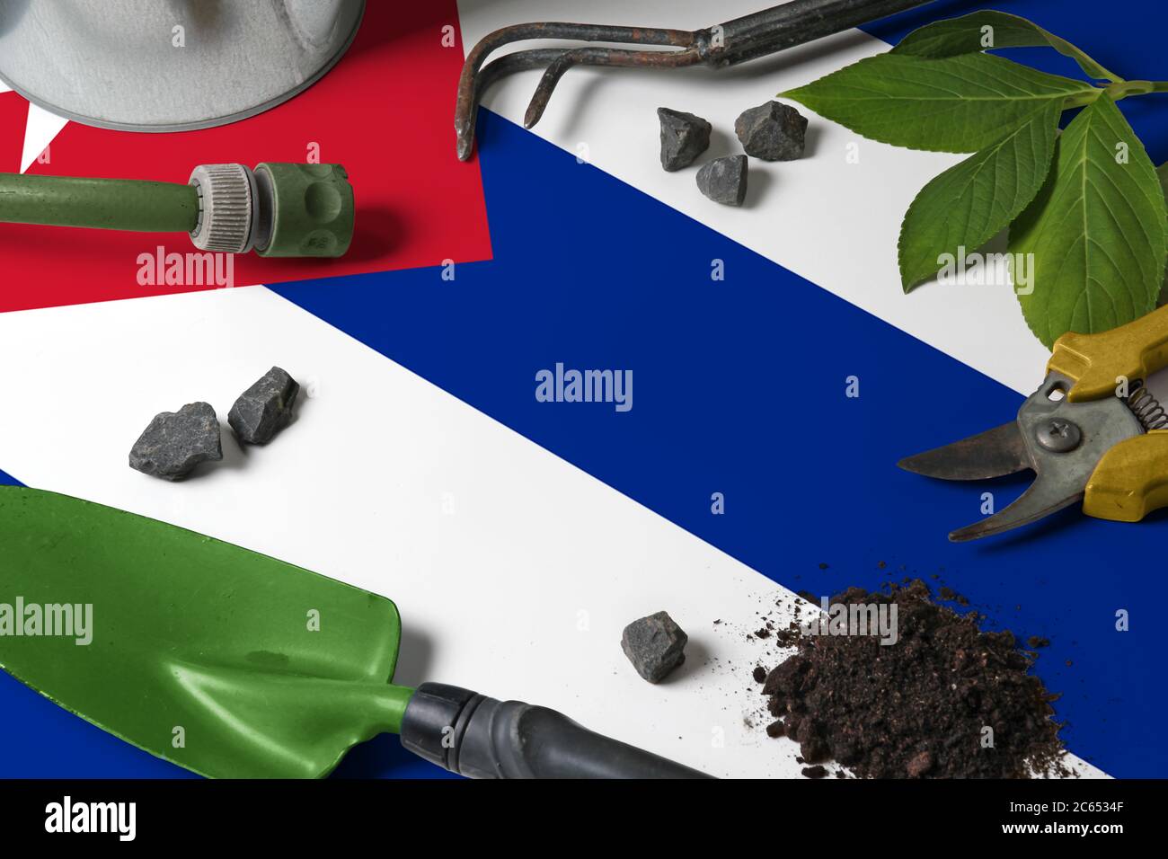 Cuba flag with gardening tools background on table. Spring in the ...