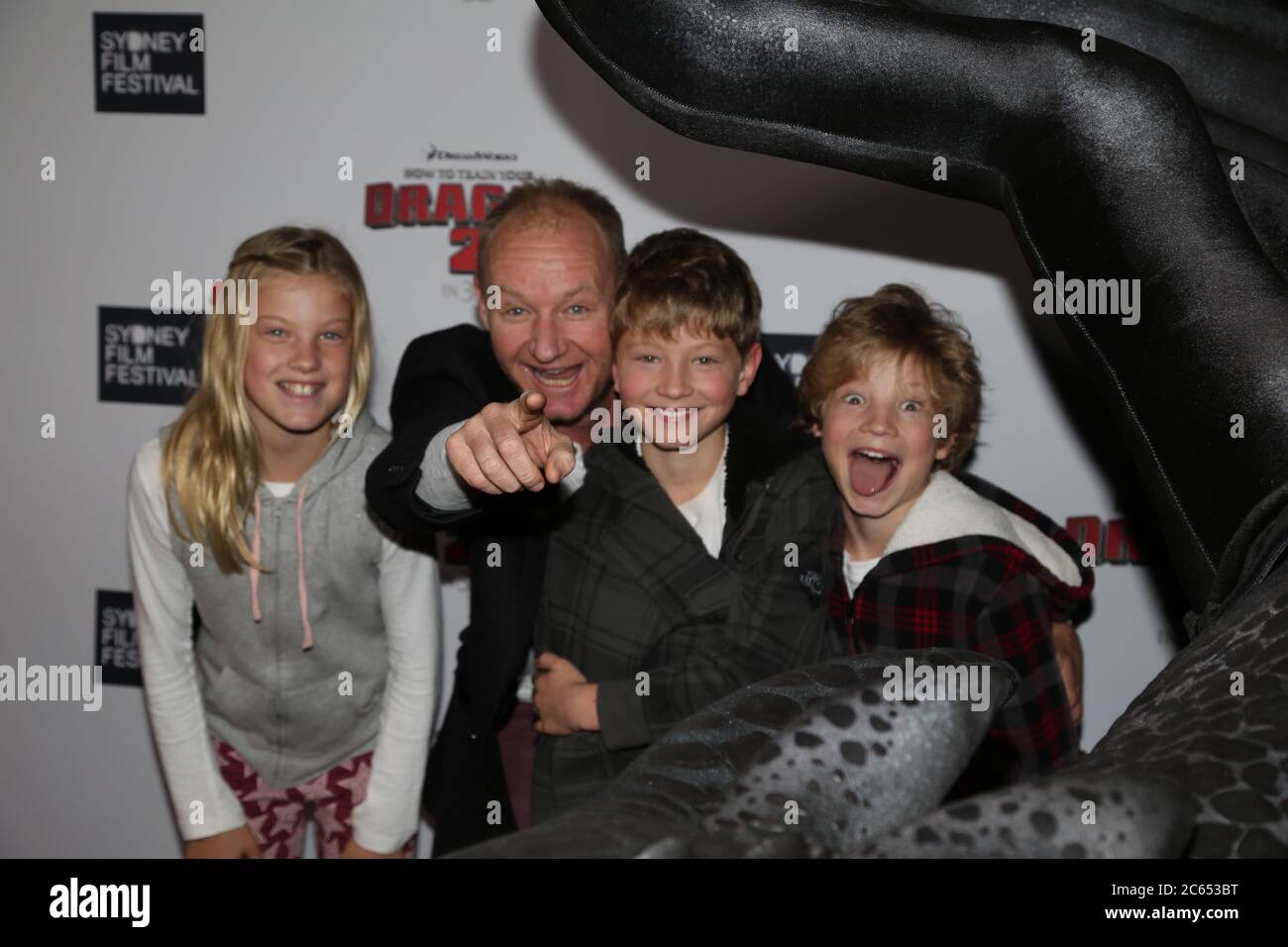 Rob Carlton arrives on the red carpet pictured with Toothless the ...
