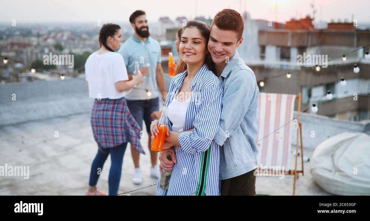 Having a great time with friends, having fun at rooftop party Stock ...