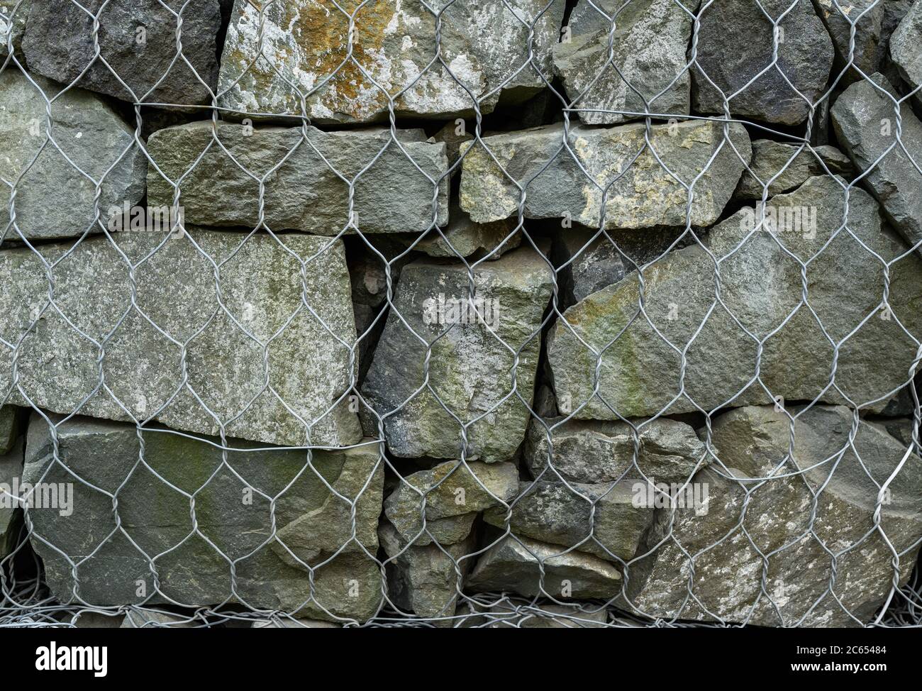 Stones covered with metal mesh Stock Photo - Alamy
