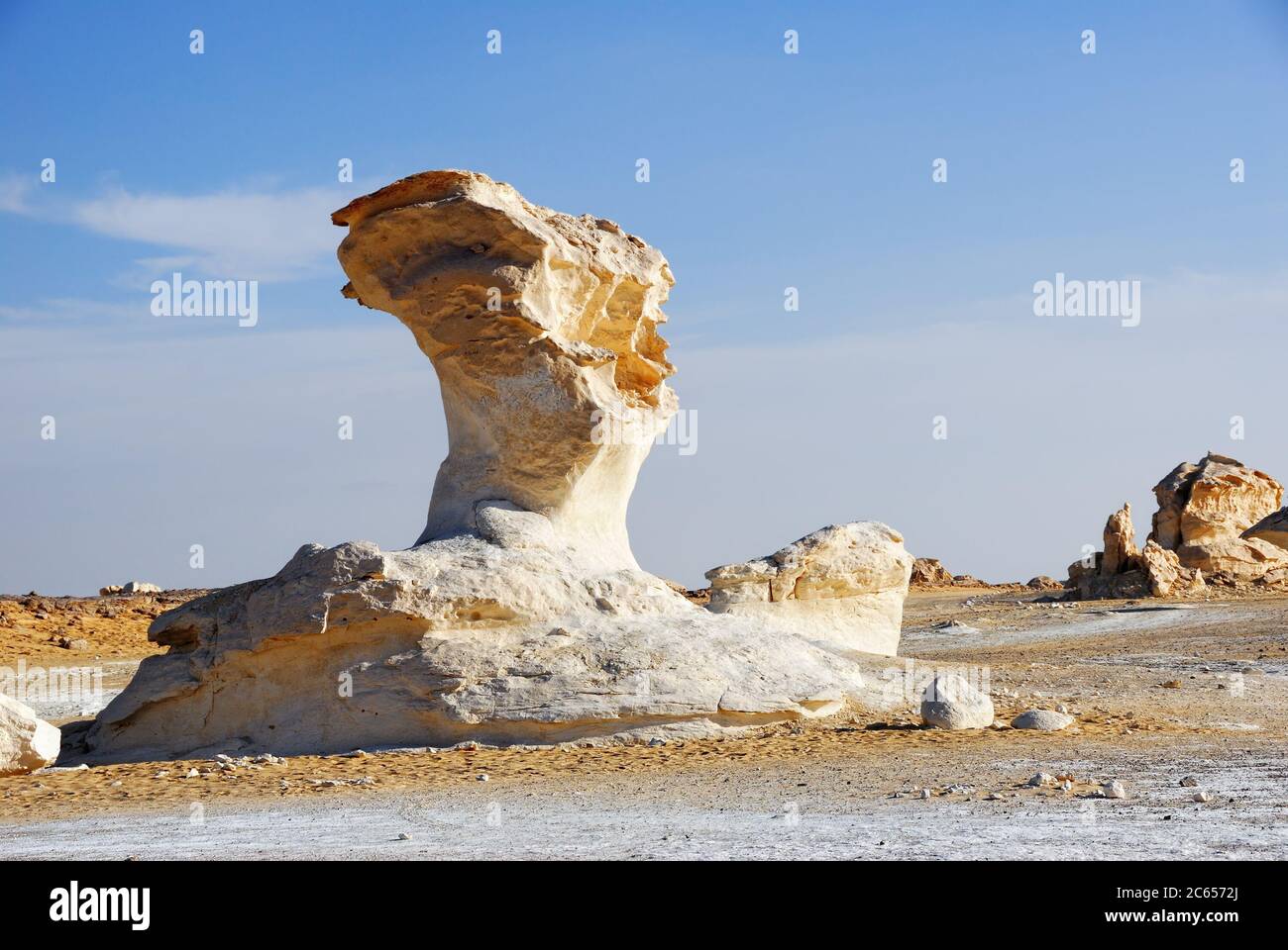 The unusual wind erosion limestone formation in White Desert at sunset ...
