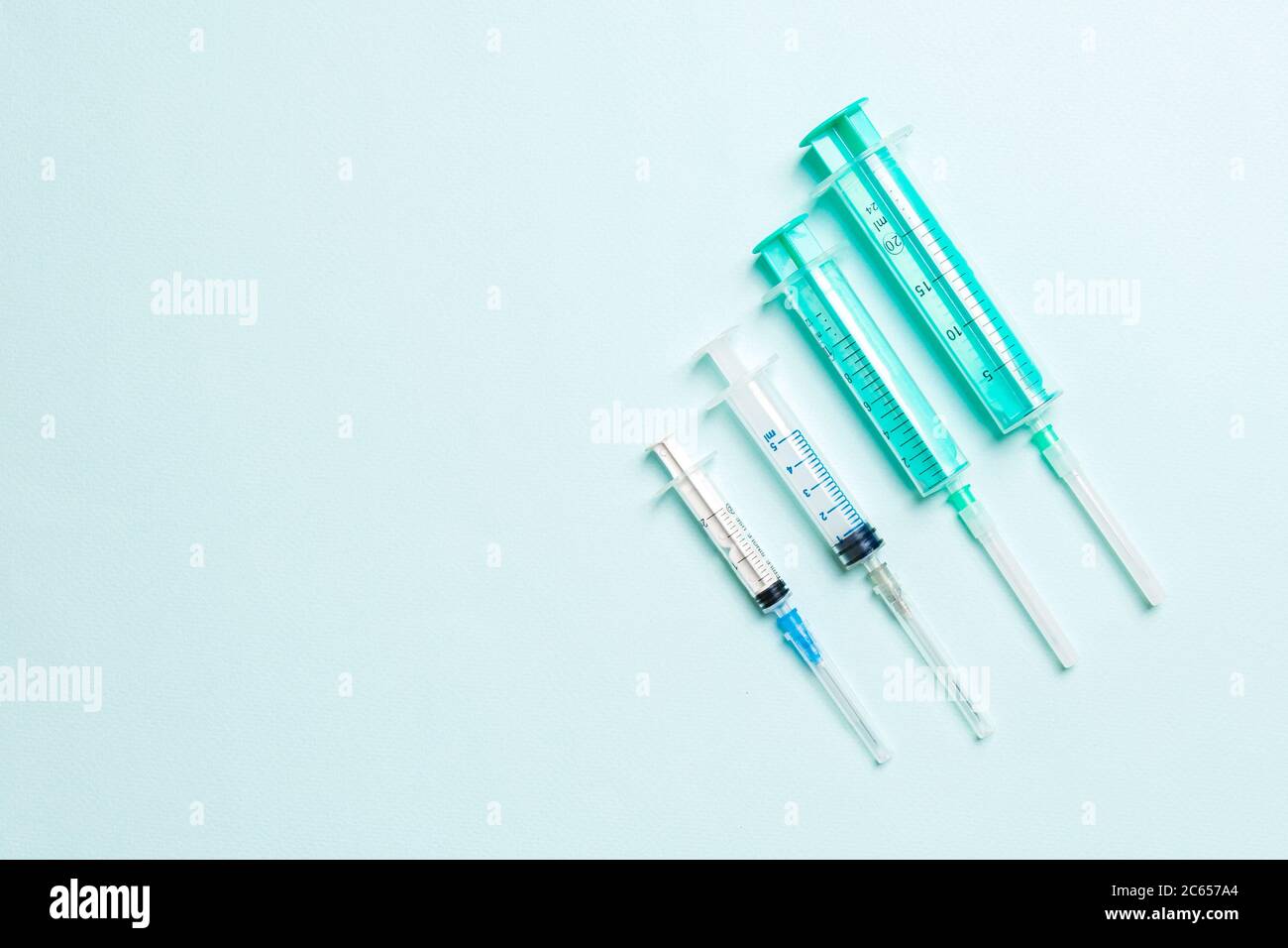 Top view of syringes in a row for medical injection on colorful ...