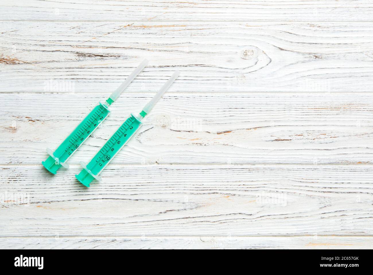 Top view of syringes on wooden background with copy space. Medical ...
