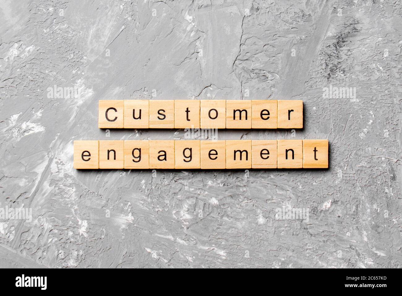 Customer engagement word written on wood block. Customer engagement ...
