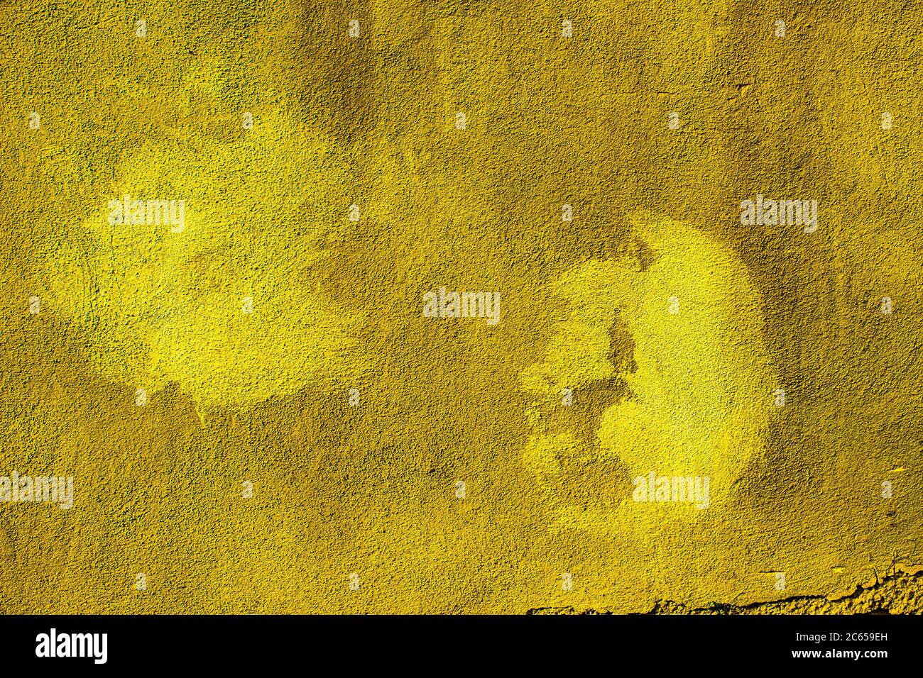 Yellow colored abstract wall background with textures of different ...