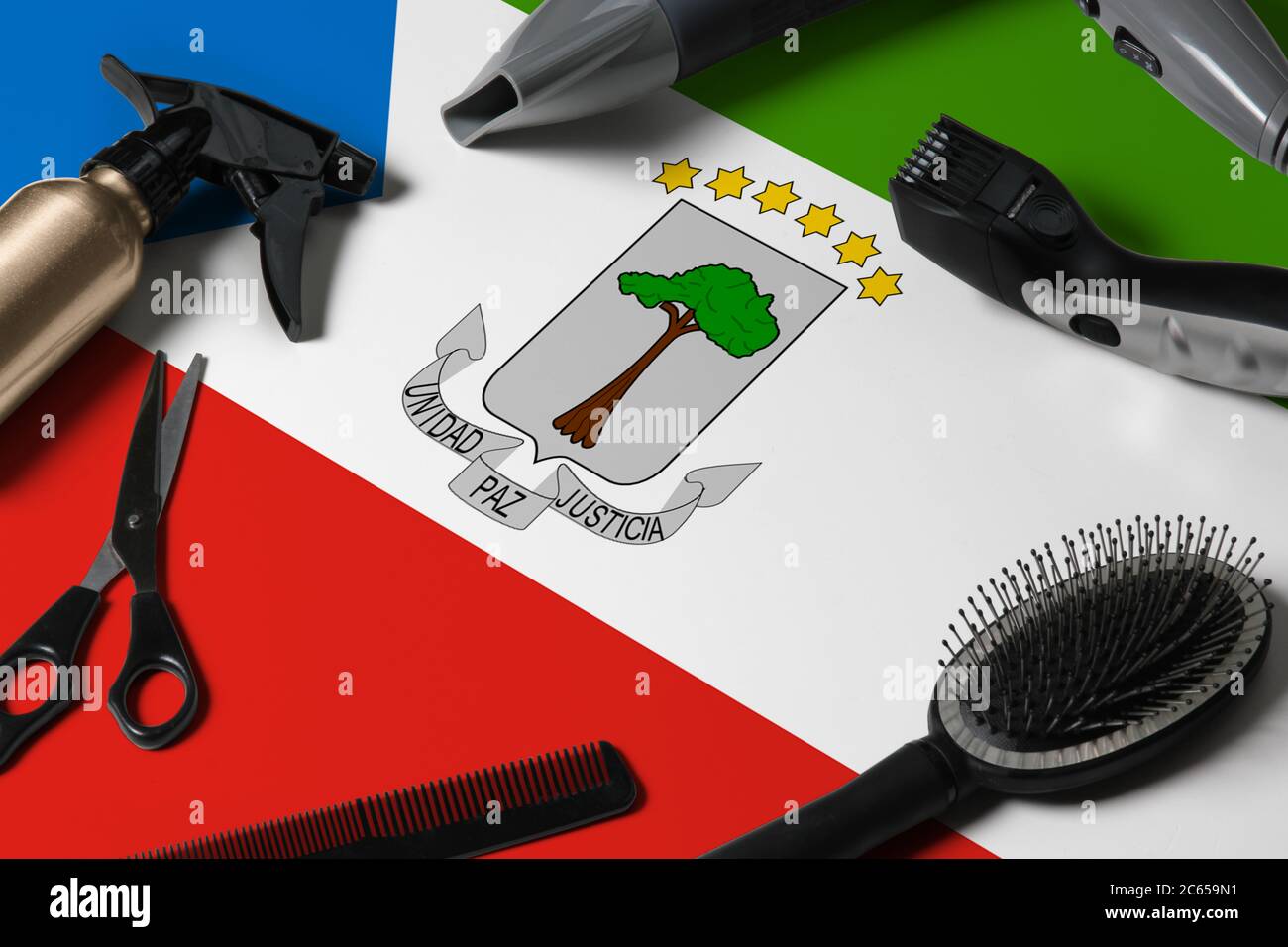 Equatorial Guinea flag with hair cutting tools. Combs, scissors and ...