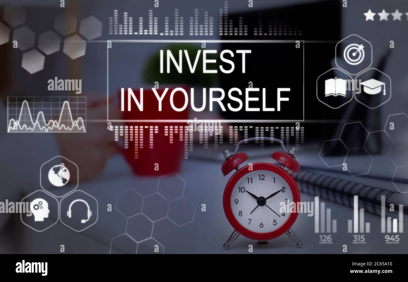 Invest In Yourself Phrase Over Background With Clock On Desk Stock ...