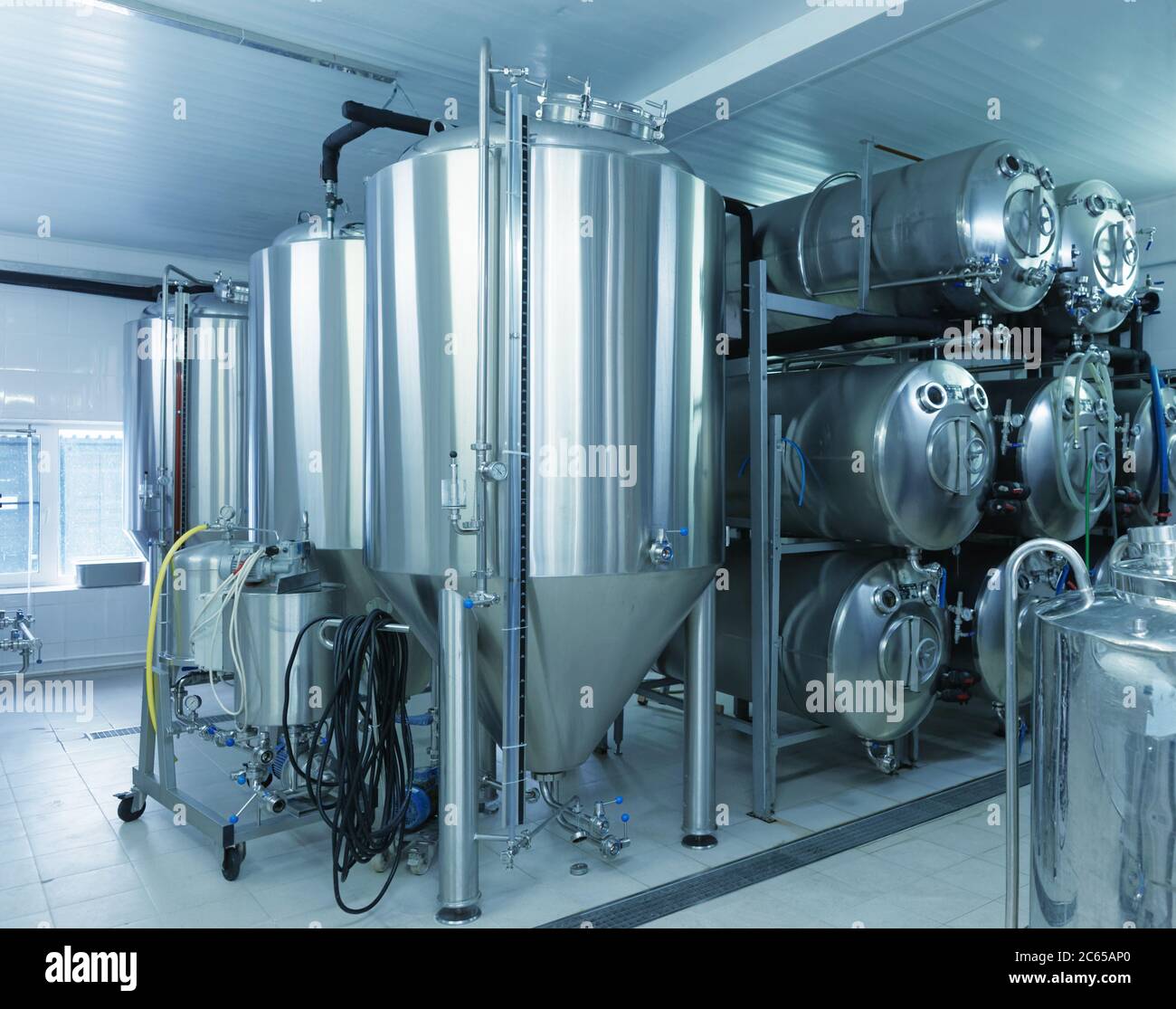 Beer storage tanks in brewery, toned image Stock Photo - Alamy